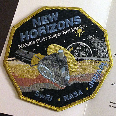 Pluto Patch Sign