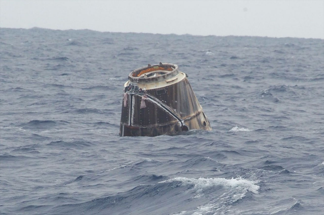 Private cargo capsule returns from historic space station mission with ...